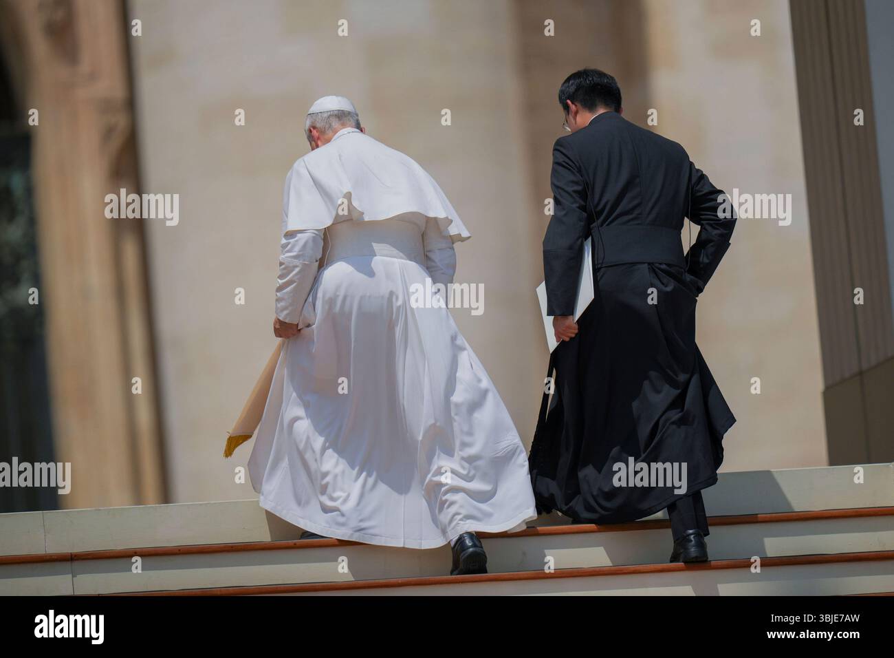 Pope Leo XIV and his secretary Edgard Iván Rimaycuna Inga, right, walk ...