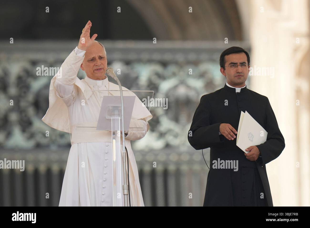 Pope Leo XIV, flanked by his secretary Edgard Iván Rimaycuna Inga ...