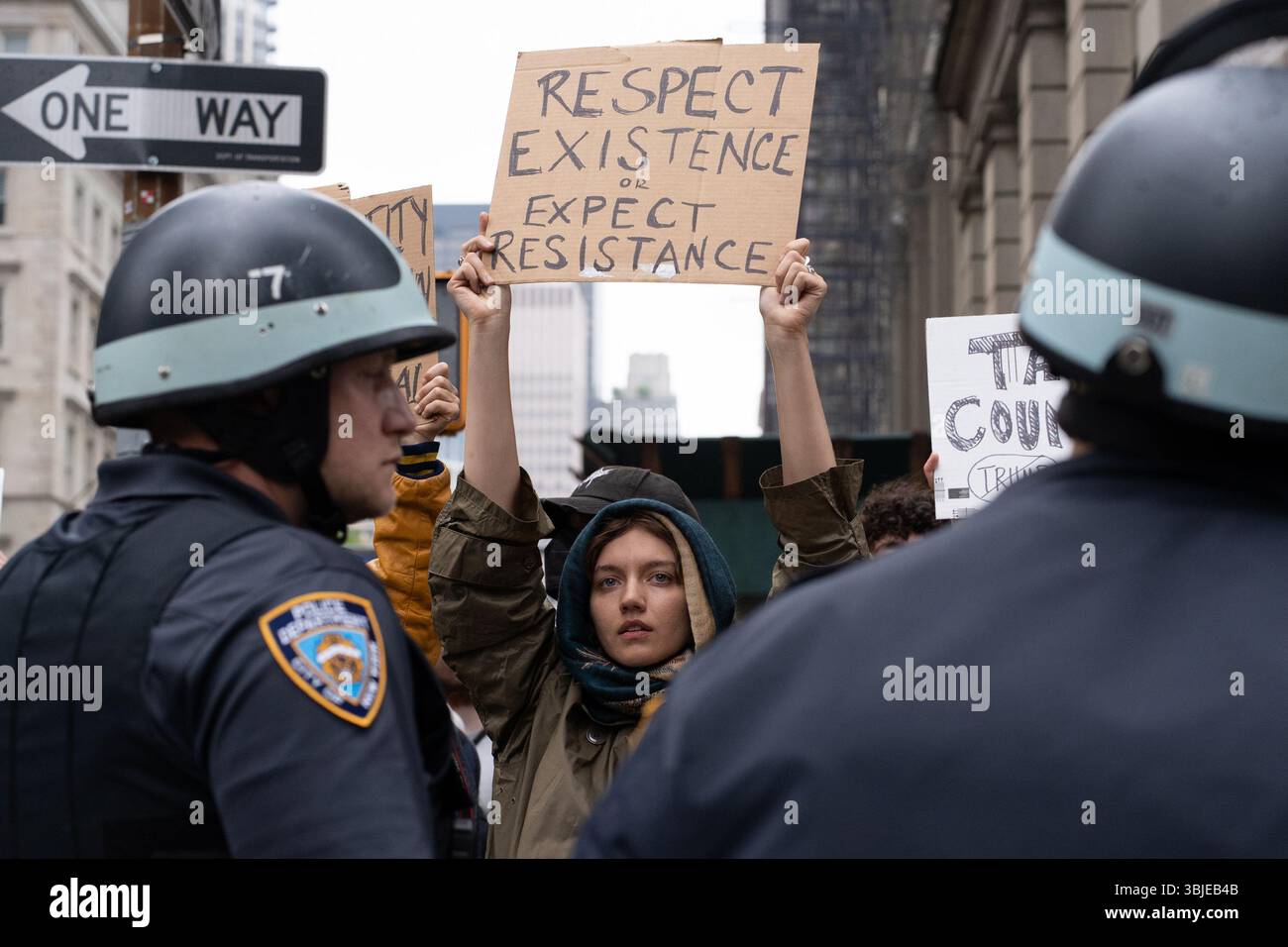 New York, United States. 14th June, 2025. Protestors hold signs at a ...