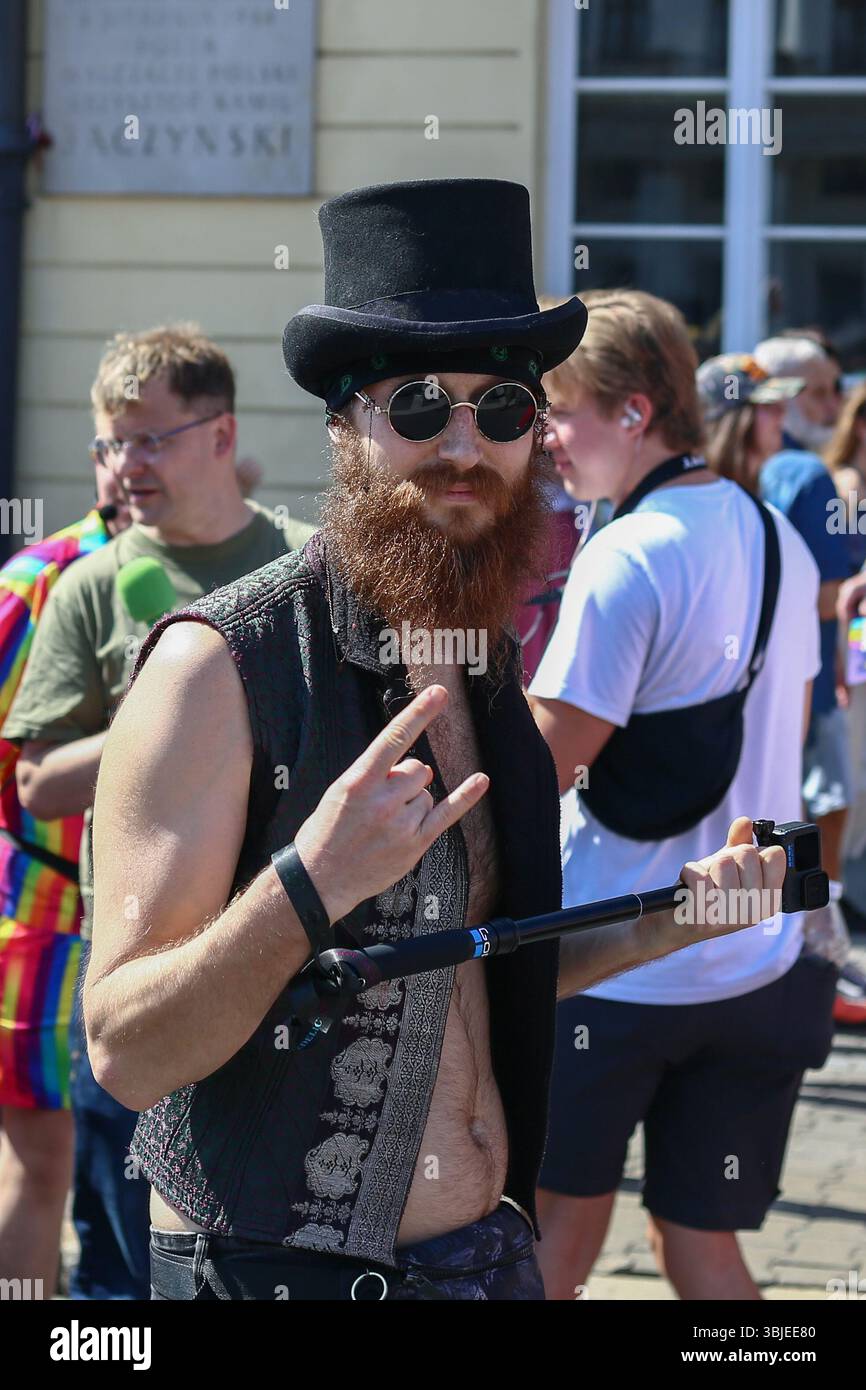 Warsaw, Poland. 14th June, 2025. A participant in a top hat and dark ...