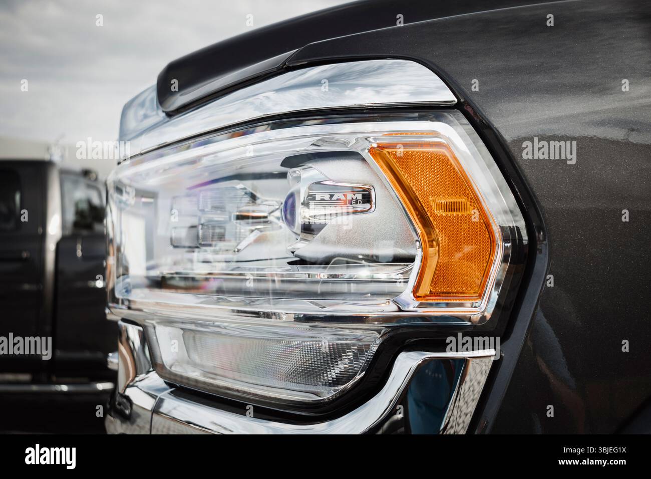 Right front headlight of a RAM pickup truck, highlighting the details ...