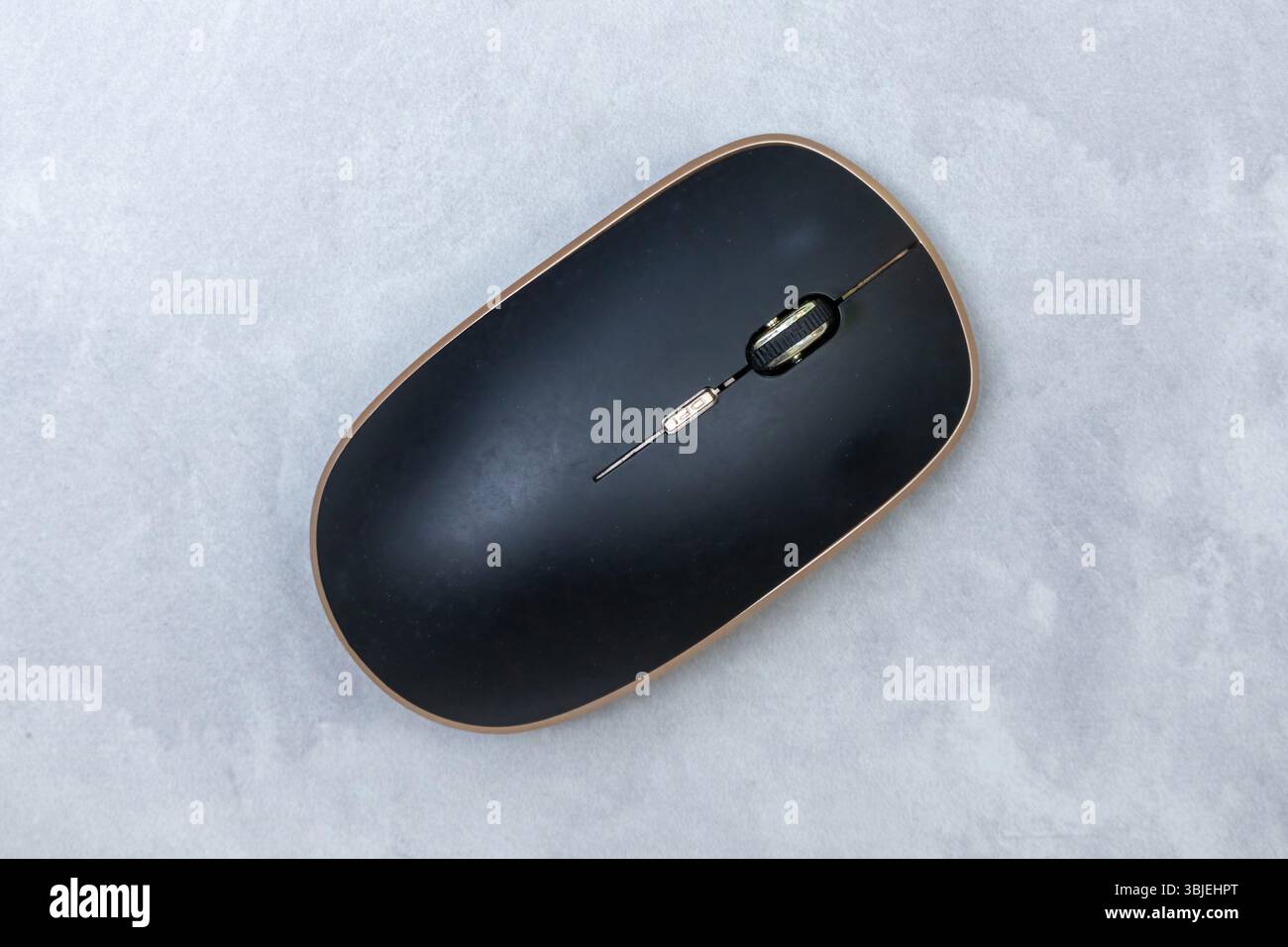 Sleek black Bluetooth wireless mouse on desk. Cordless computer input ...