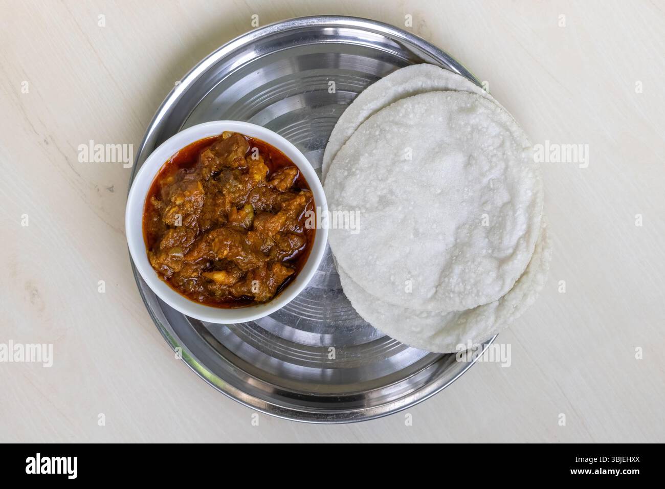 Delicious Bengali Beef Bhuna Curry with Roti on Steel Plate, Wooden ...