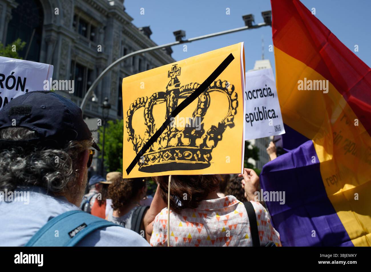 Madrid, Spain. 15th June, 2025. Protesters carry a banner and ...