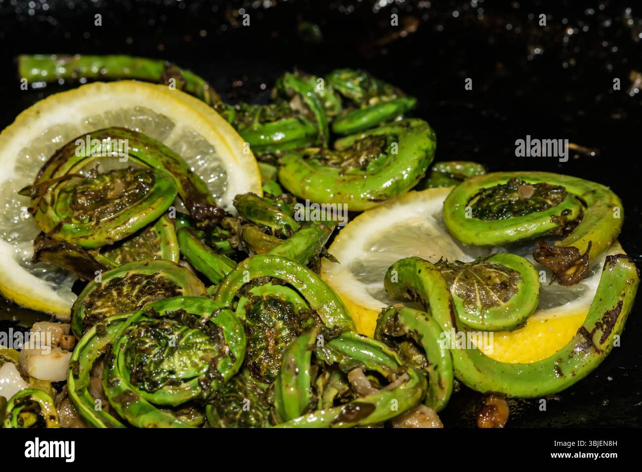 Sautéed Fiddlehead Ferns Stock Photo - Alamy