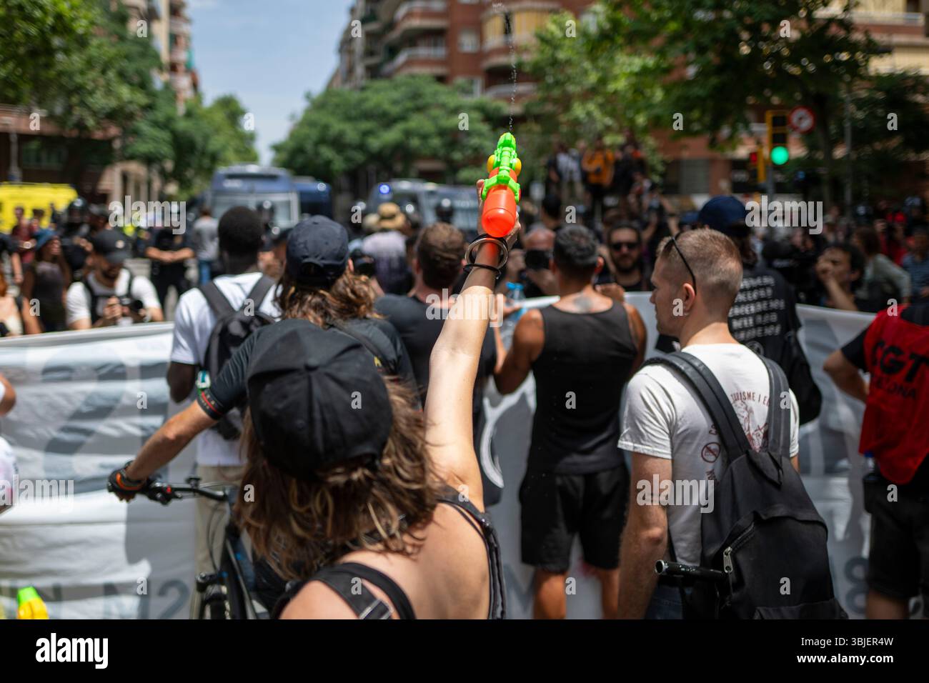 Several people with water guns during a demonstration against tourist ...