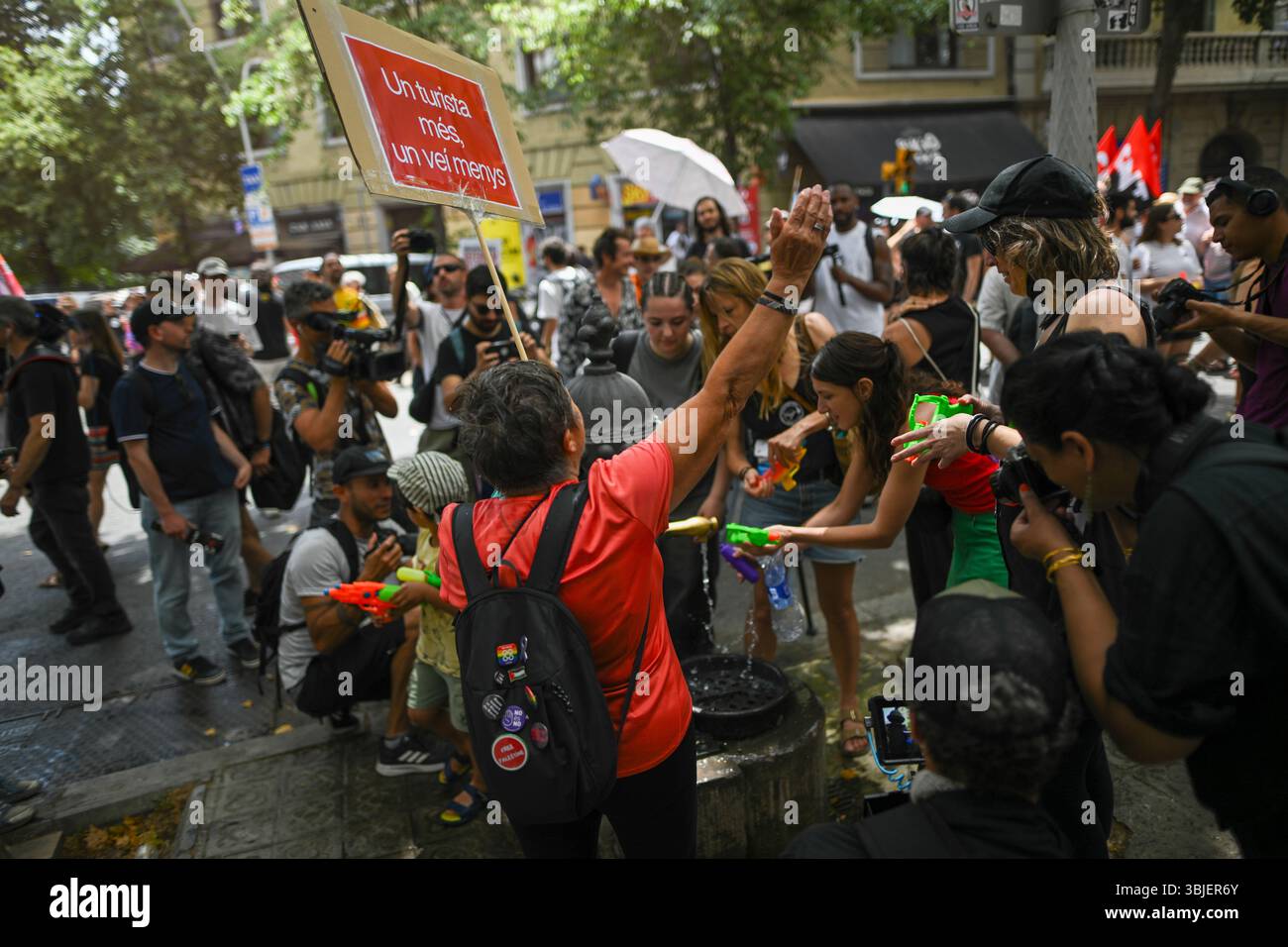 Several people with water guns during a demonstration against tourist ...