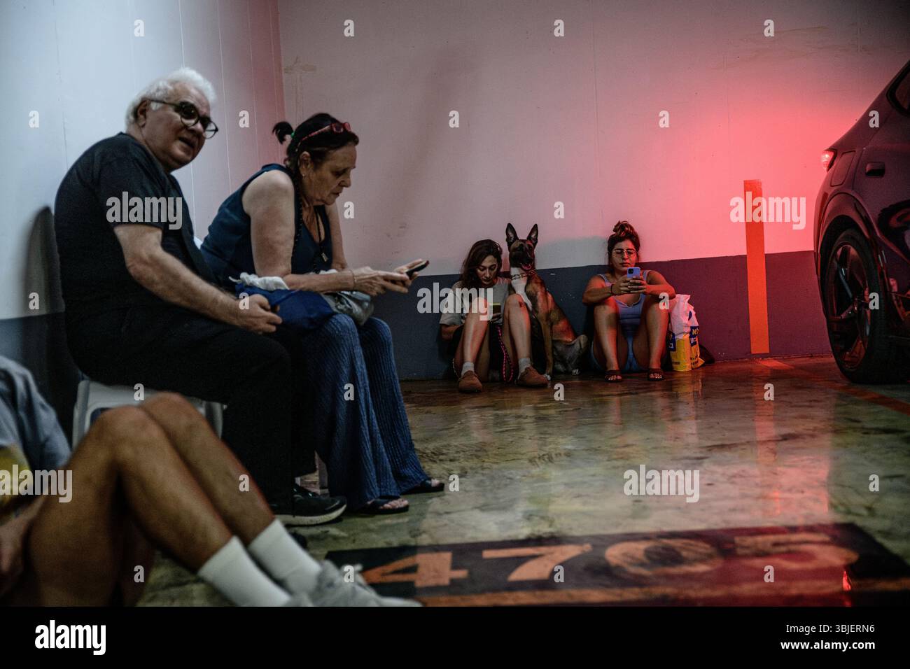 Israelis taking shelter in a public underground facility during an ...