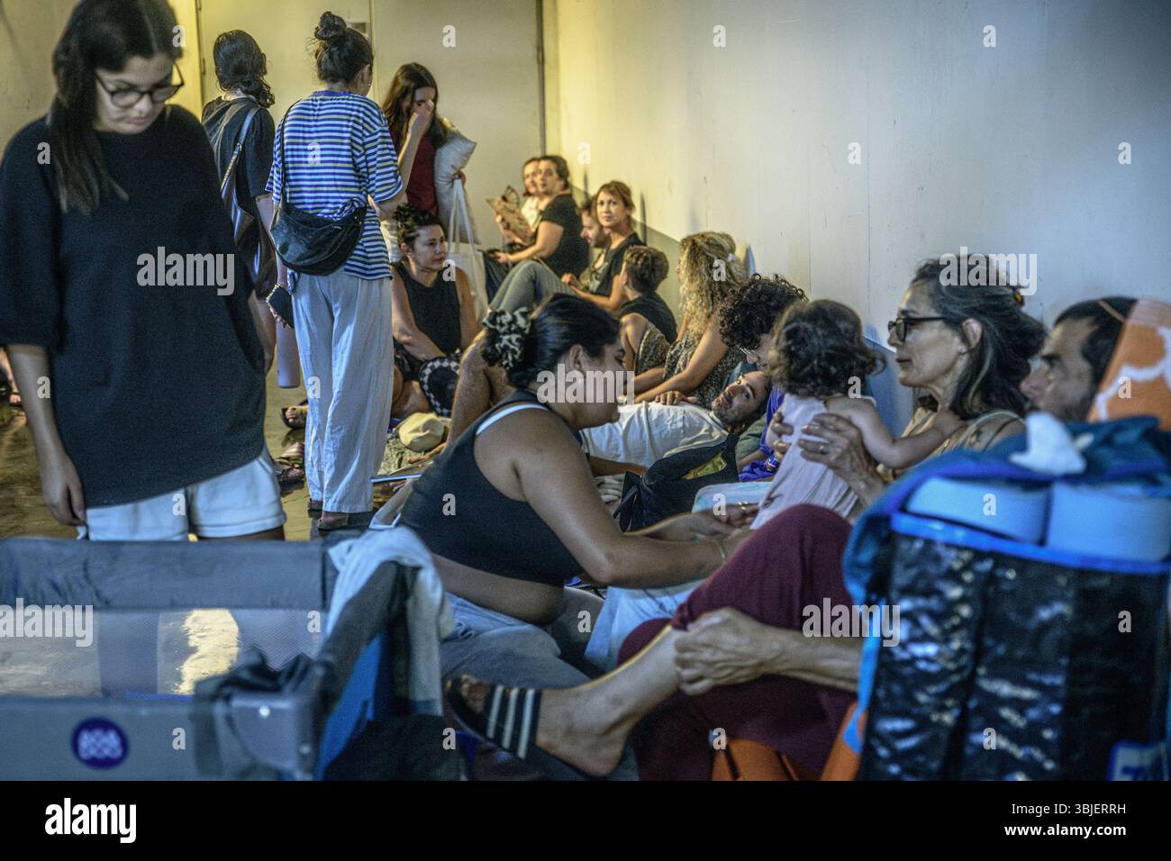 Israelis taking shelter in a public underground facility during an ...