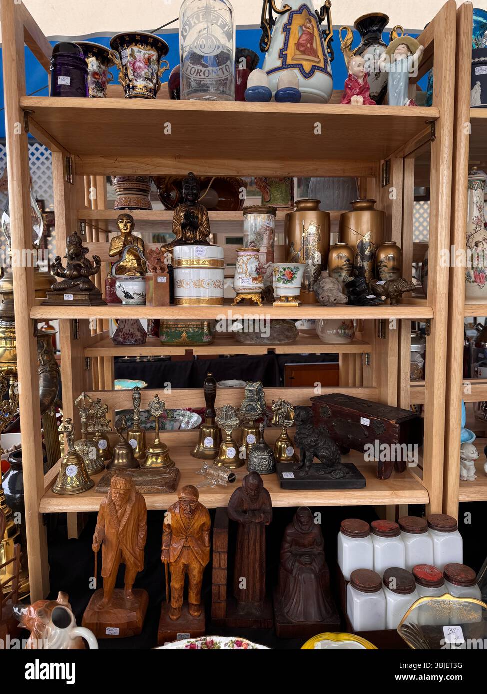 antique market stall with brass and wood objects Stock Photo - Alamy