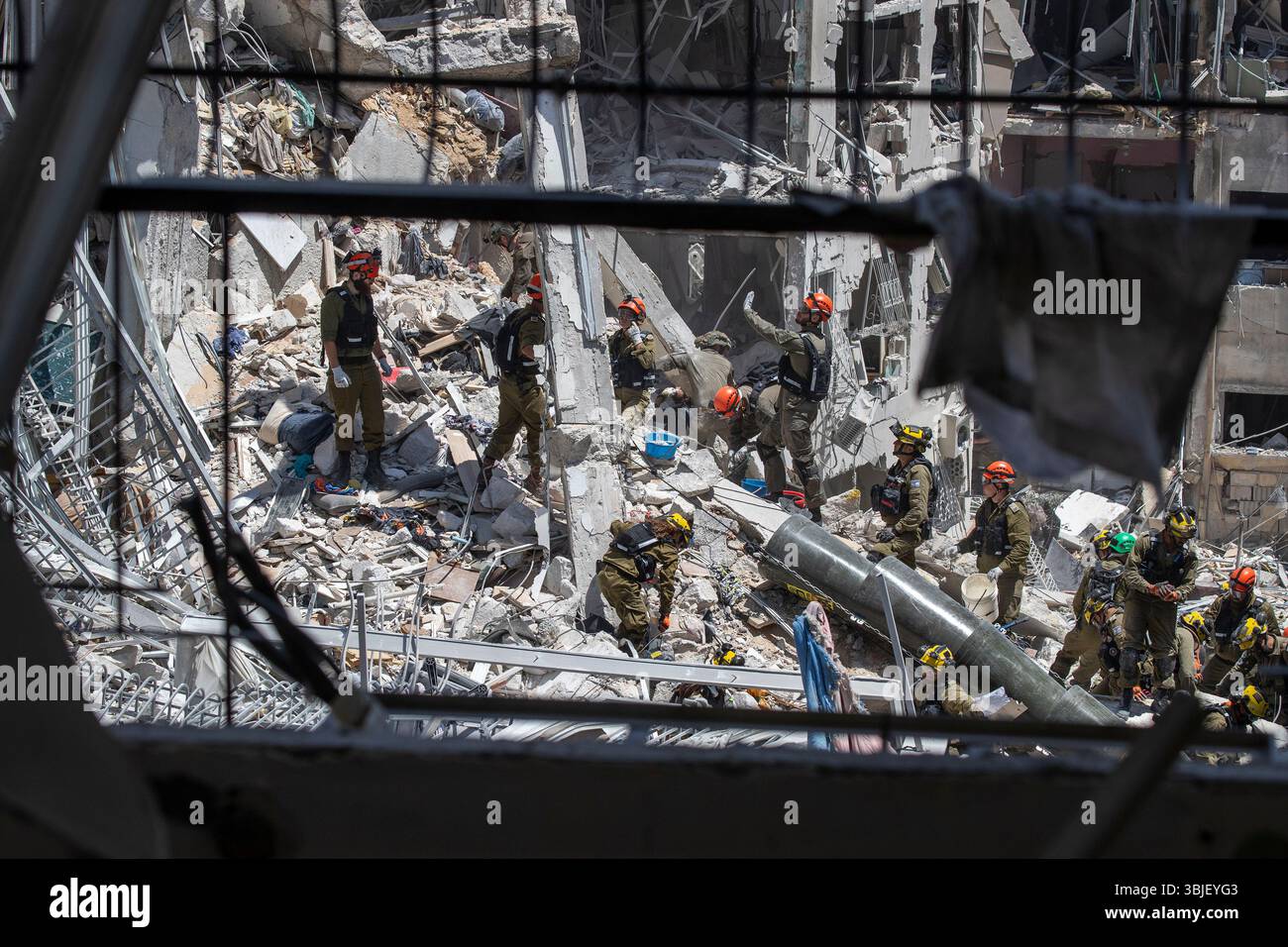 Israeli military rescue personnel from the Home Front Command search ...