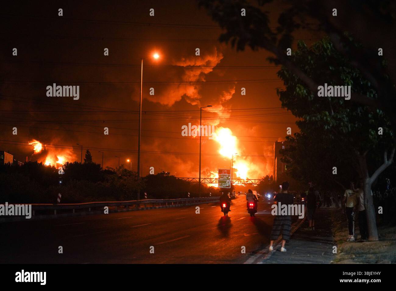 Tehran, Iran. 15th June, 2025. Iranians looking as a plume of heavy ...