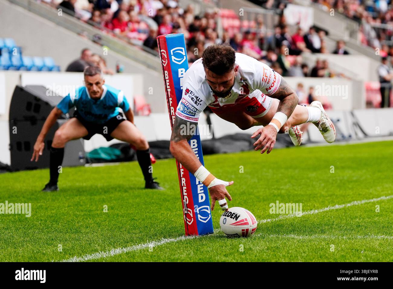 St Helens' Kyle Feldt scores their side's fourth try of the game during ...