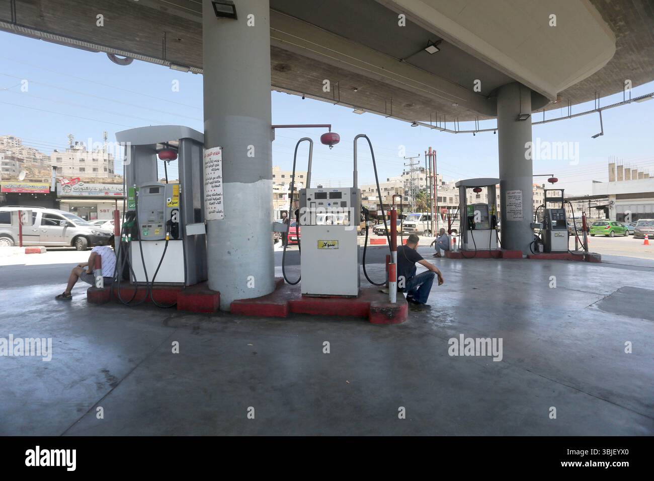 Nablus, Palestine. 15th June, 2025. Palestinians wait at a gas station ...