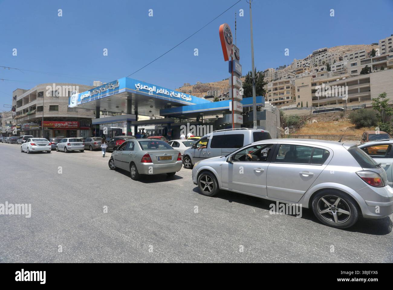Nablus, Palestine. 15th June, 2025. Palestinian cars line up outside ...