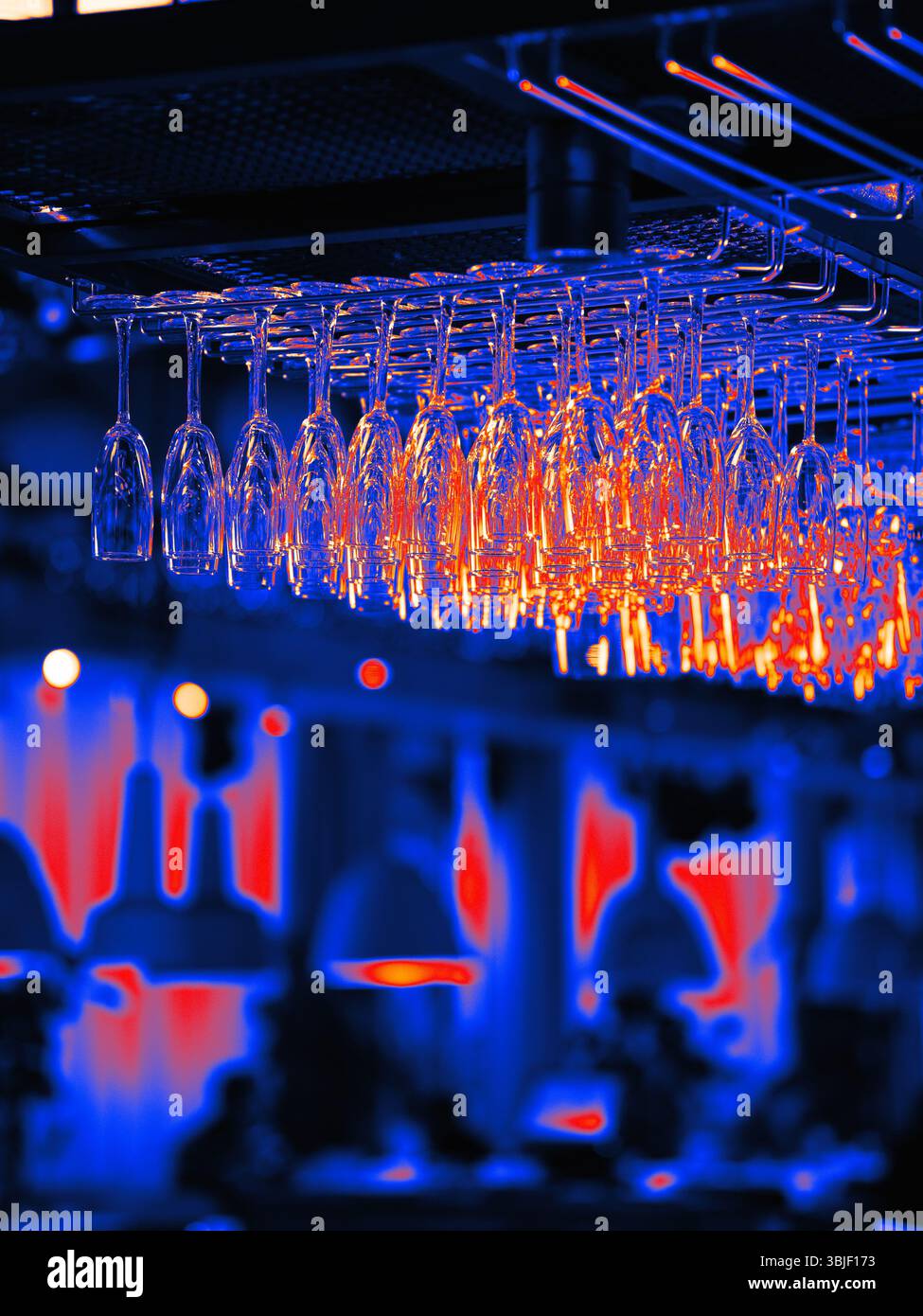 Infrared Thermal image of row of clean empty glasses in bar. Moody ...