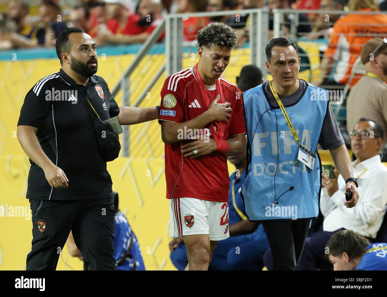 Al Ahly FC midfielder Akram Tawfik (22) left the pitch in tears after ...