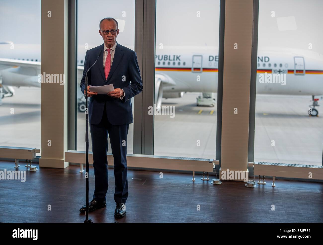 15 June 2025, Brandenburg, Schönefeld: German Chancellor Friedrich Merz (CDU) speaks during a ...