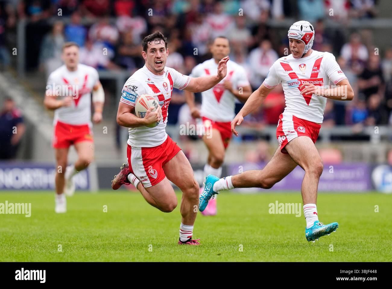 St Helens' Matt Whitley (left) in action with George Whitby during the ...