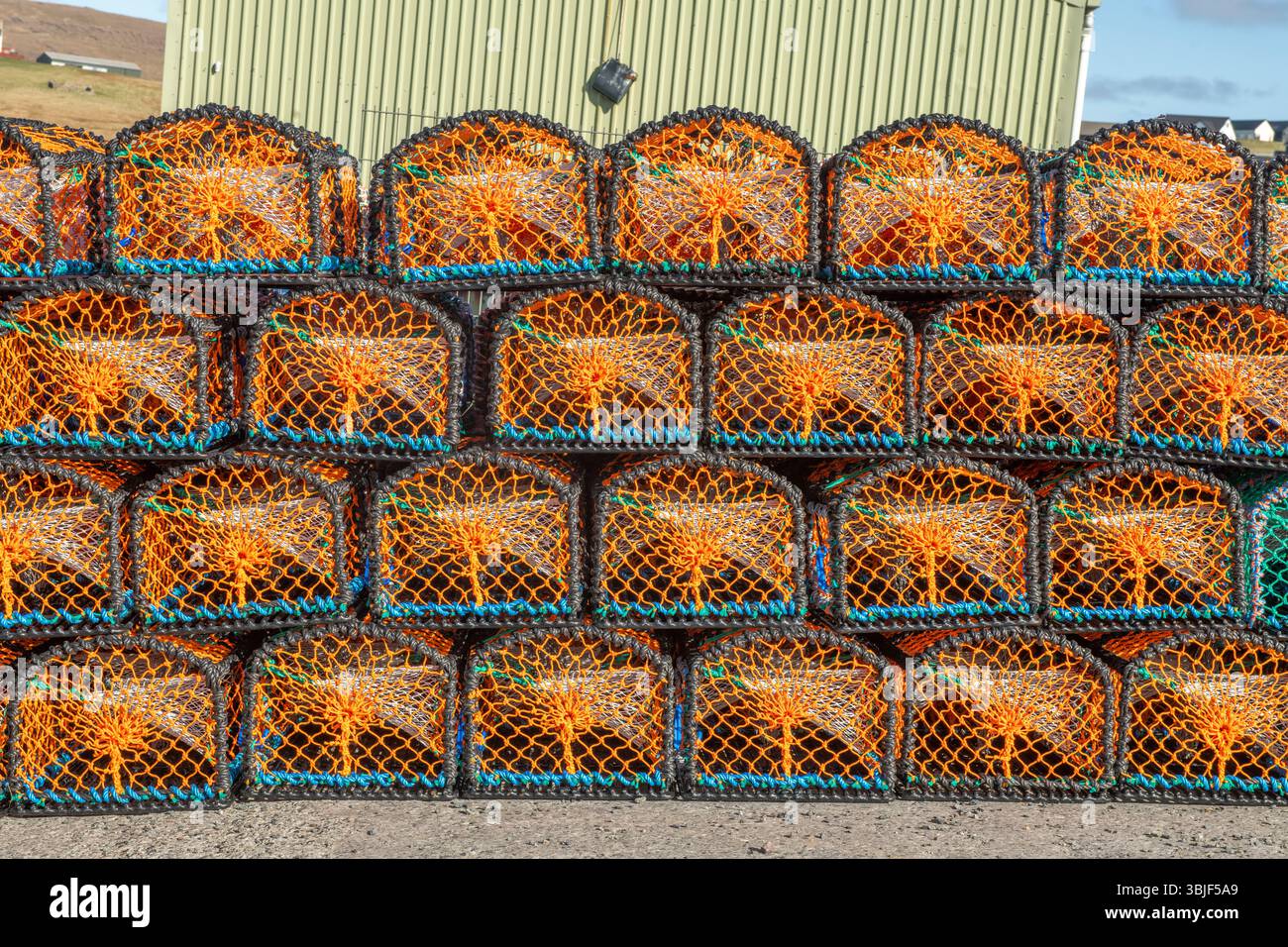 Neatly stacked lobster creels signal the rhythm of coastal life ...