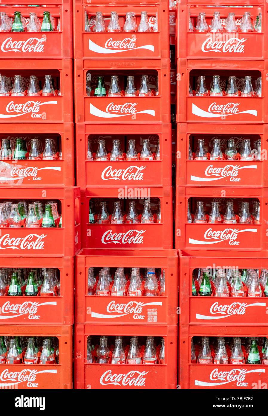 Empty soft drink glass bottles in red stacked Coca Cola boxes Stock ...