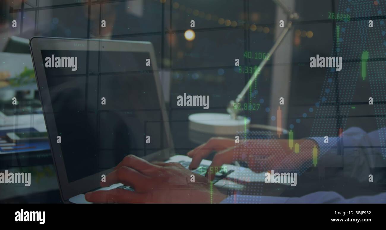 Typing man in shirt inputting market data on laptop in modern office ...