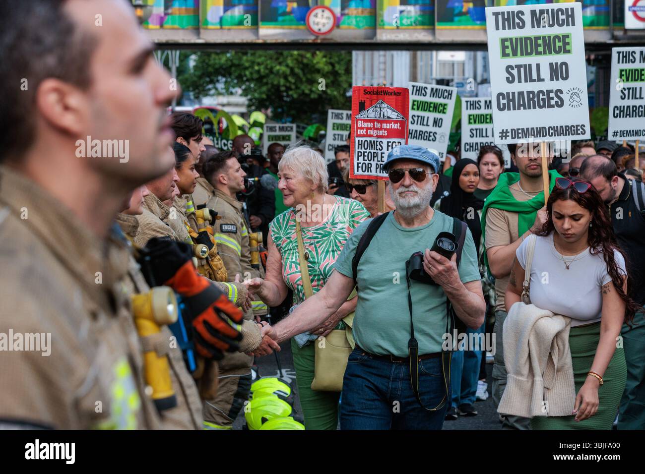 London, UK. 14th June, 2025. Members of the Grenfell community shake ...