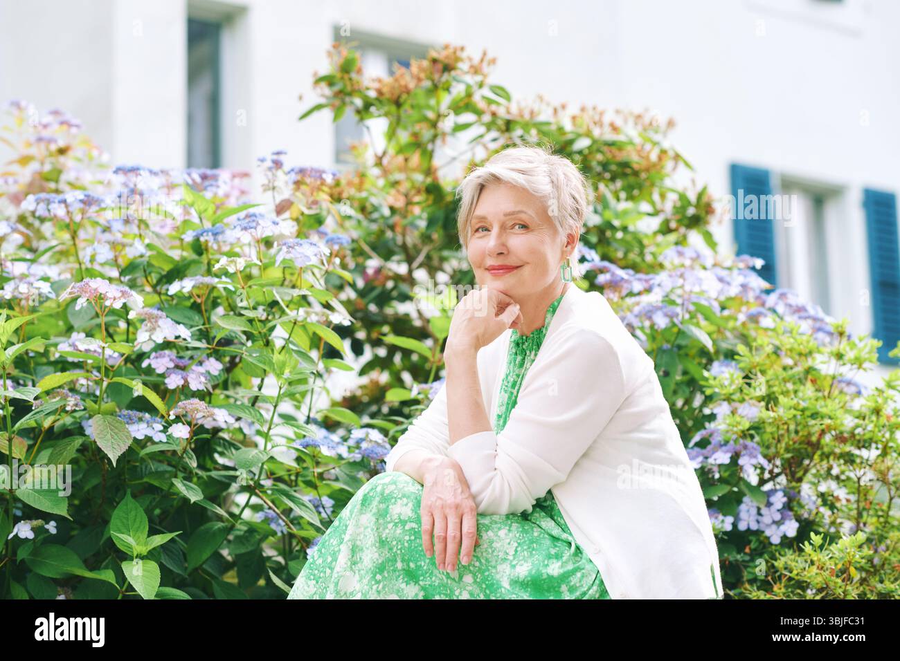 Outdoor portrait of beautiful mature woman of 55 - 60 year old, nice ...