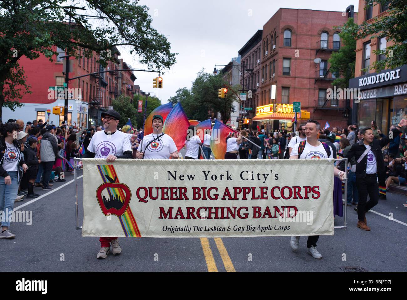 A street scene at a parade features the New York City's Queer Big Apple ...