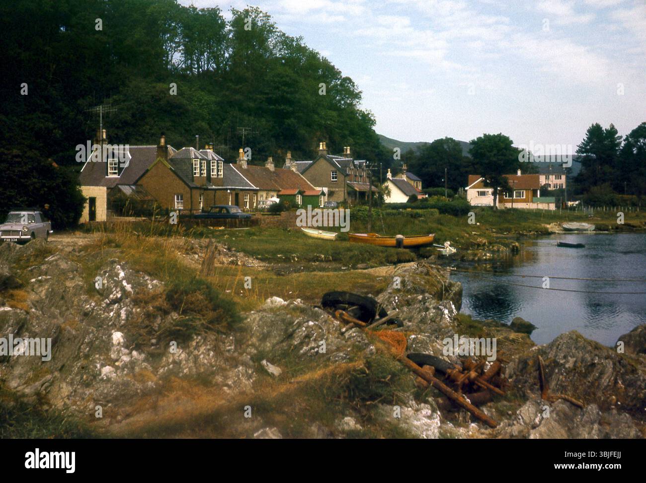 Scotland in the 1960s - View of houses and boats in Carradale village ...