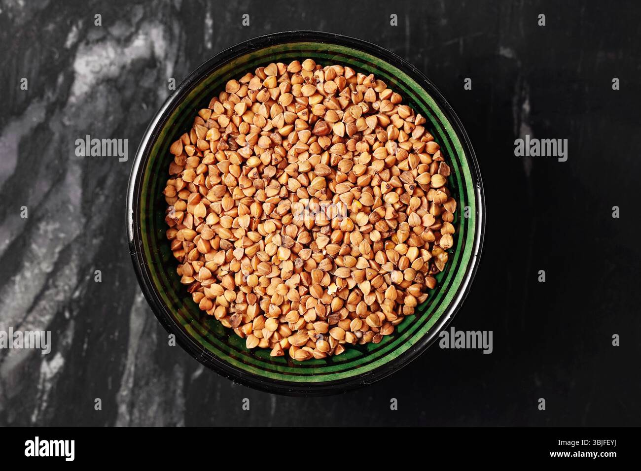 Roasted buckwheat in bowl. Organic whole grain. Healthy vegan food ...