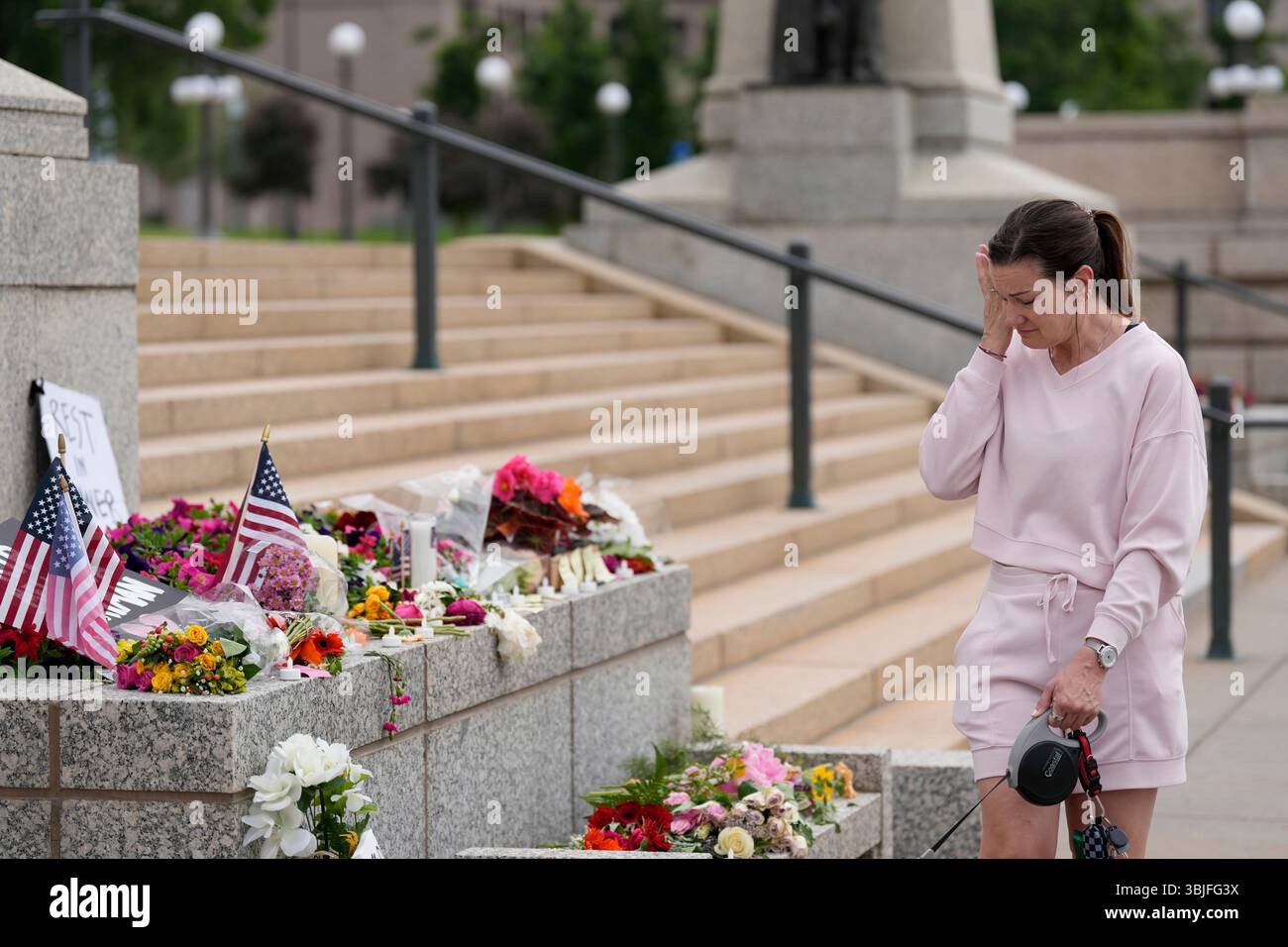 Leah Palmer visits a makeshift memorial for Minnesota state Rep. Melissa Hortman and her husband ...