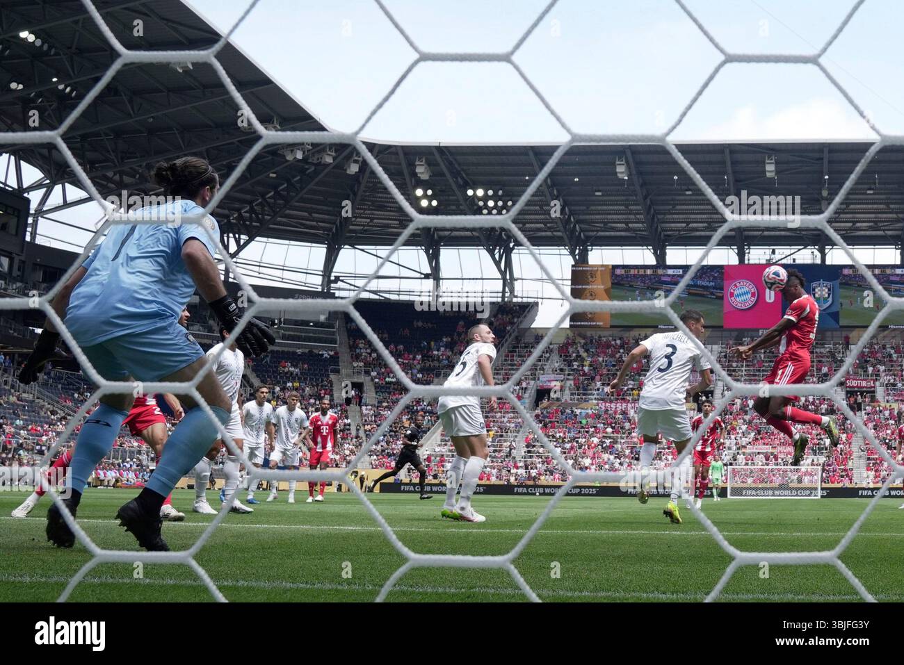 Bayern Munich's Kingsley Coman, right, heads the ball to score the ...