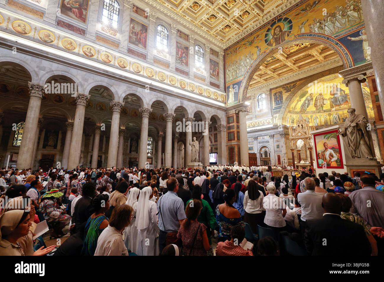 Faithful attend a ceremony for the beatification of Floribert Bwana ...