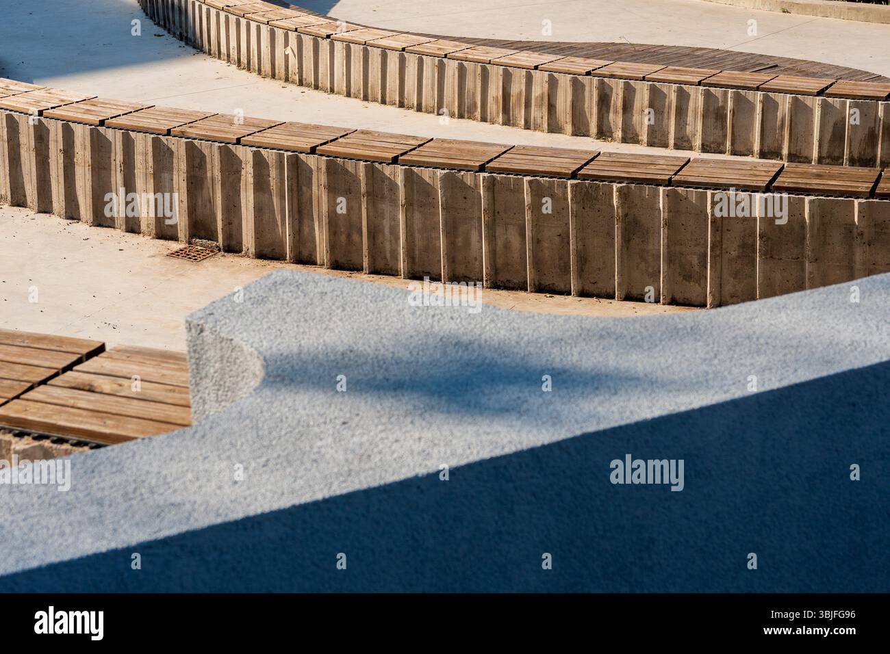 Timber and Concrete Harmony in Sunlight and Shadow Stock Photo - Alamy