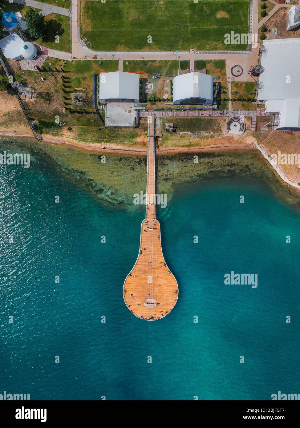 Directly overhead aerial view of the unique Komuz shaped pier on Issyk ...
