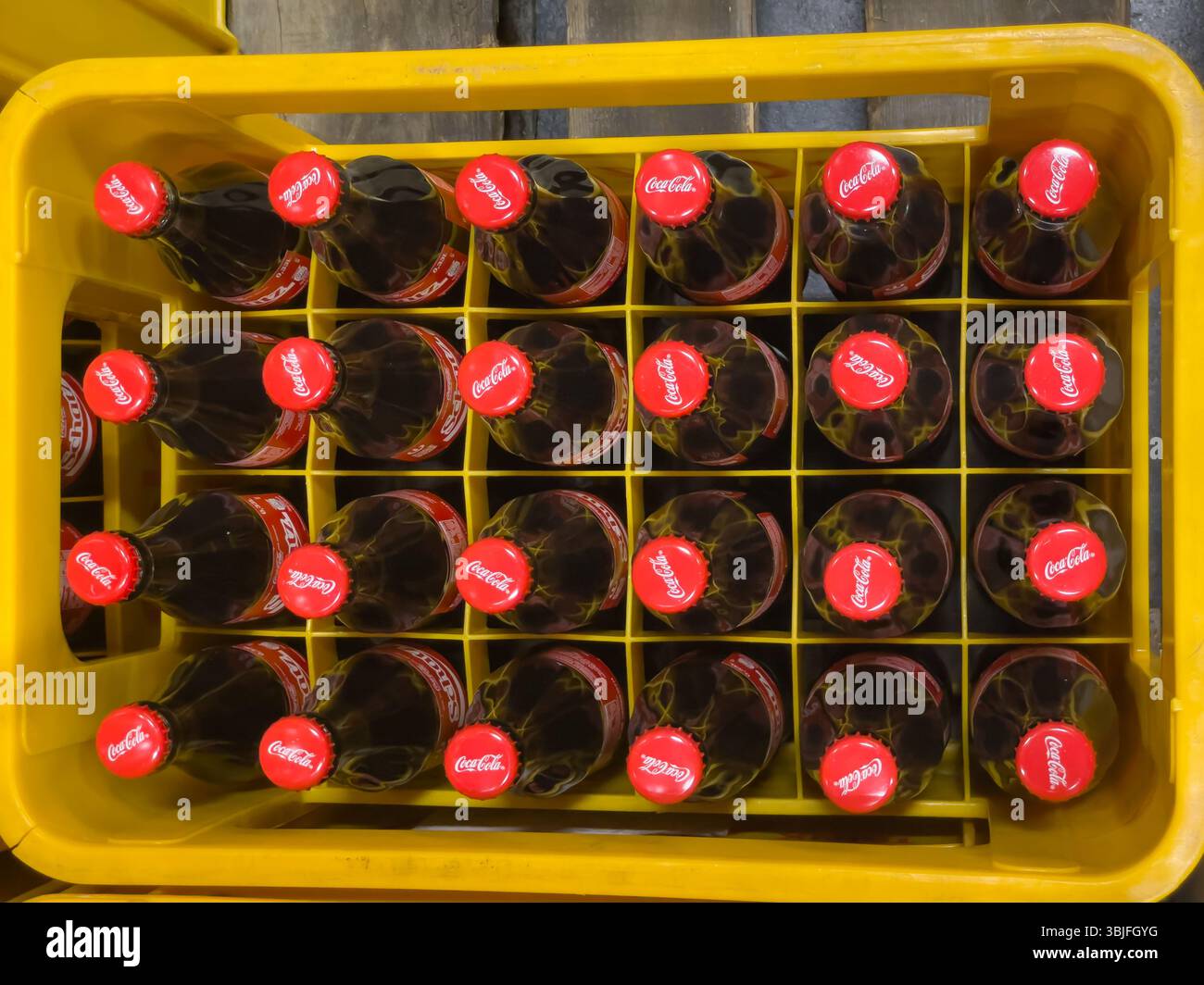Germany Berlin June 7, 2025. Crate containing 24 Coca-Cola bottles ...
