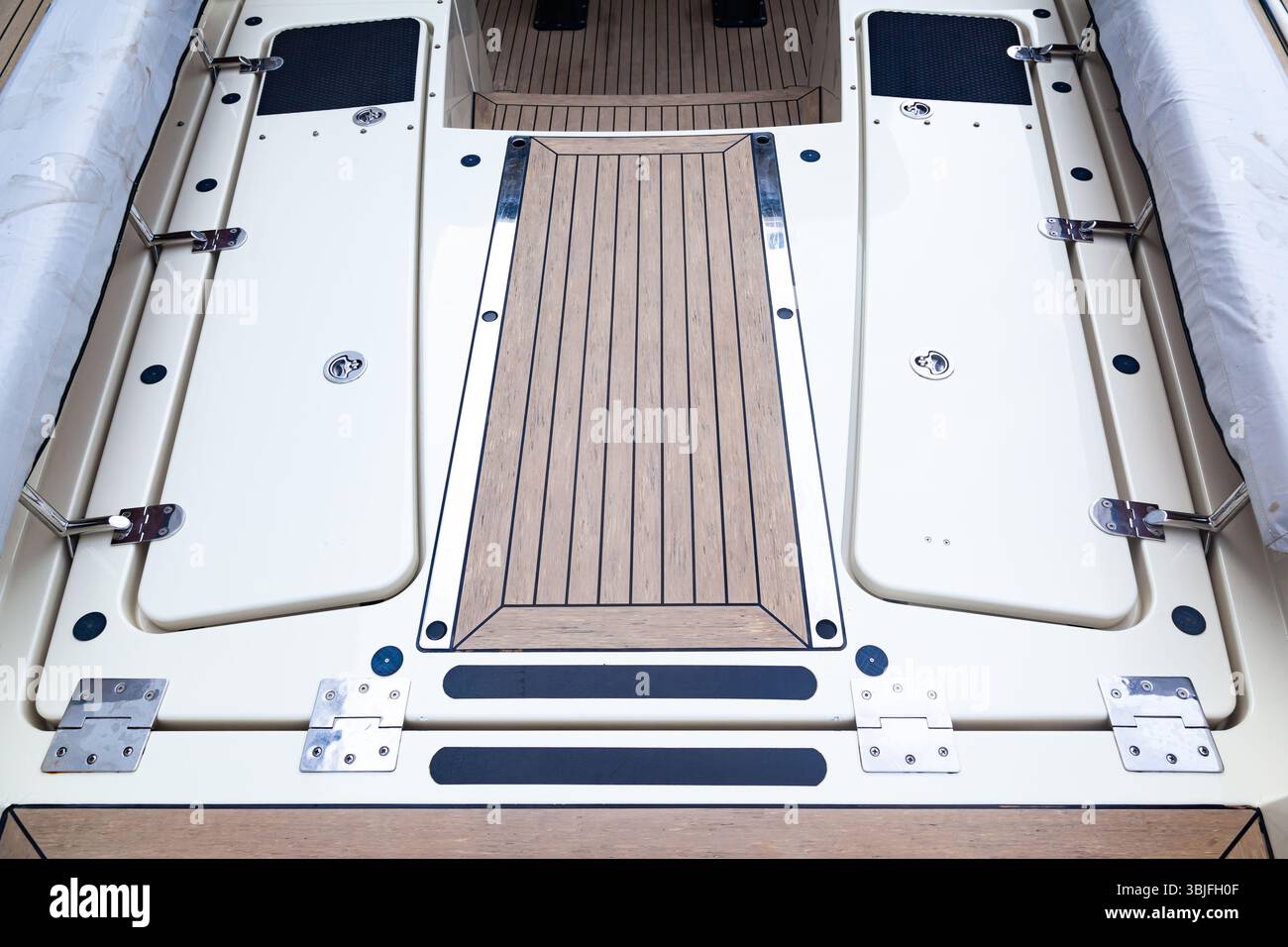 Deck of a luxury modern yacht with closed hatches and steps Stock Photo ...