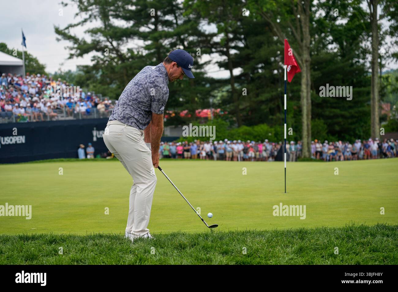 Nick Taylor, of Canada, chips onto the second green during the final ...