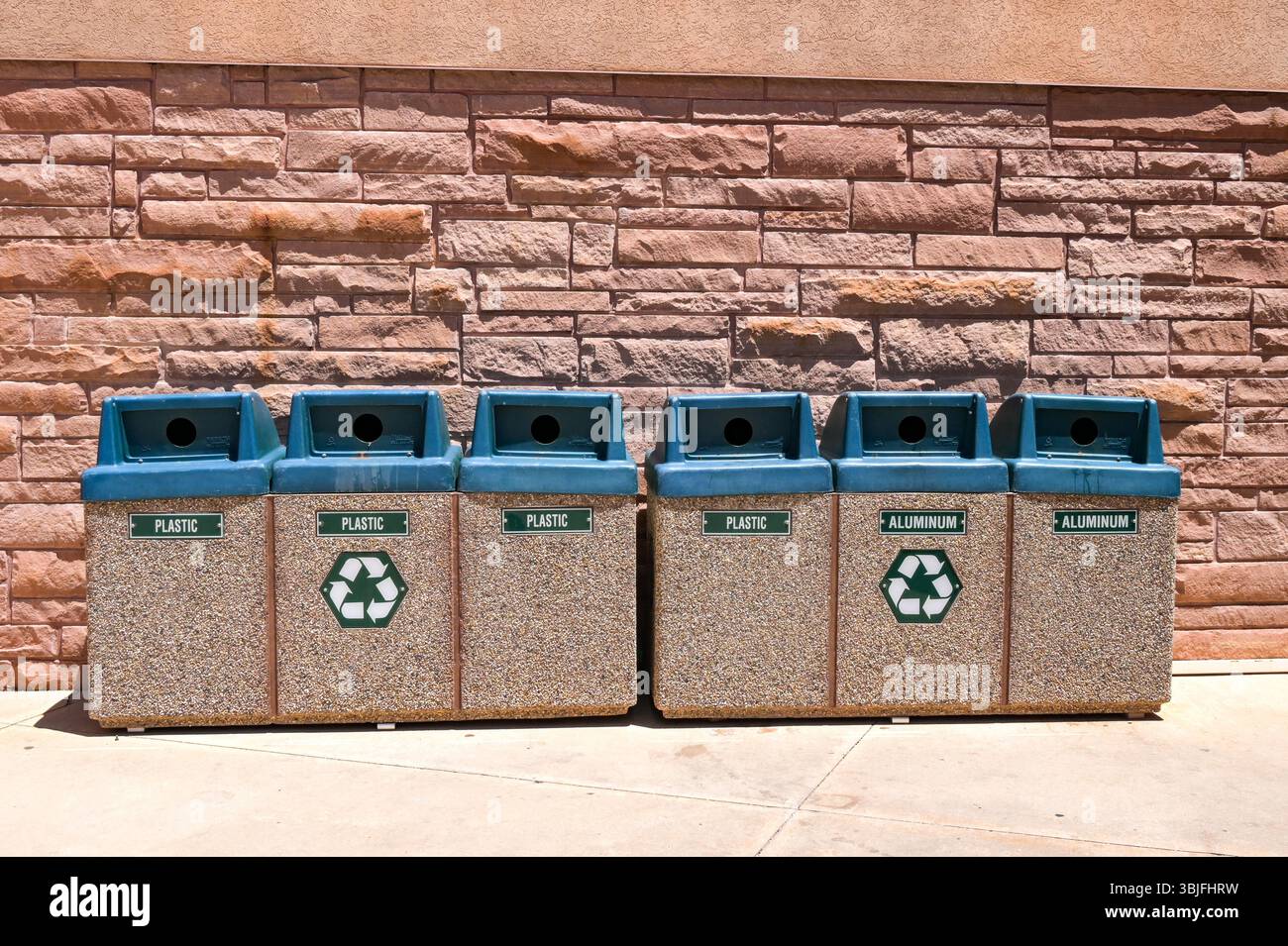 Moab, Utah, USA - 25 May 2025: Row of bins to recycle different types ...