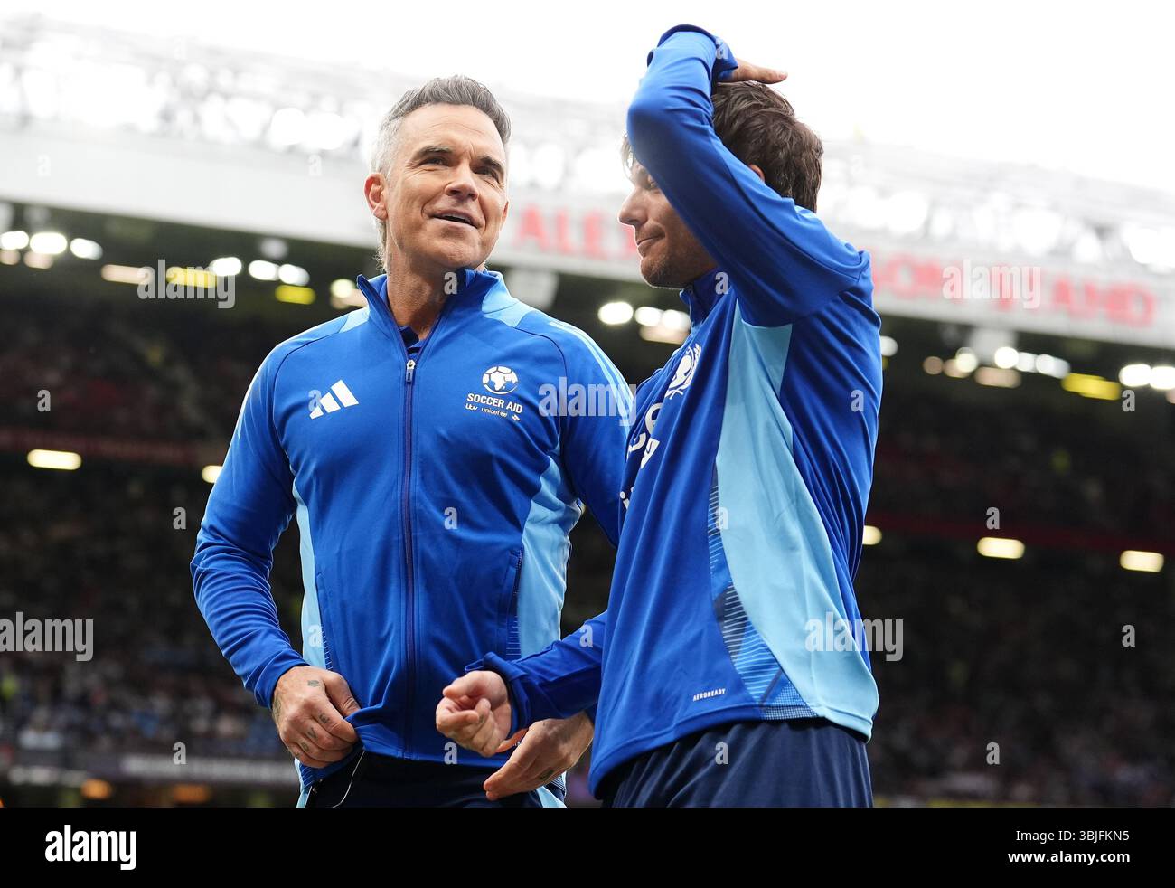 England's Louis Tomlinson (right) and Robbie Williams ahead of Soccer ...