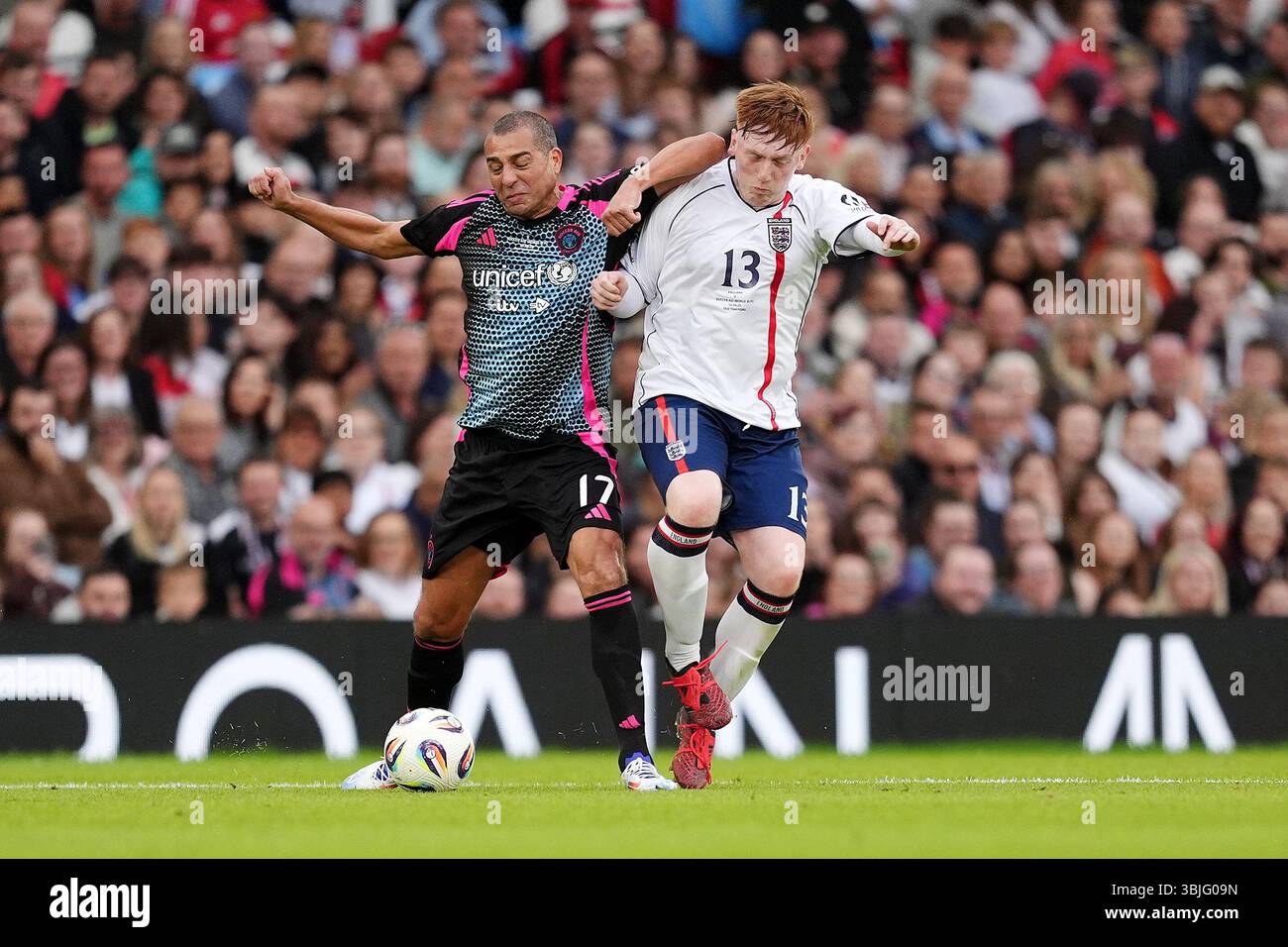 World XI's David Trezeguet (left) and England's Angry Ginge battle for ...