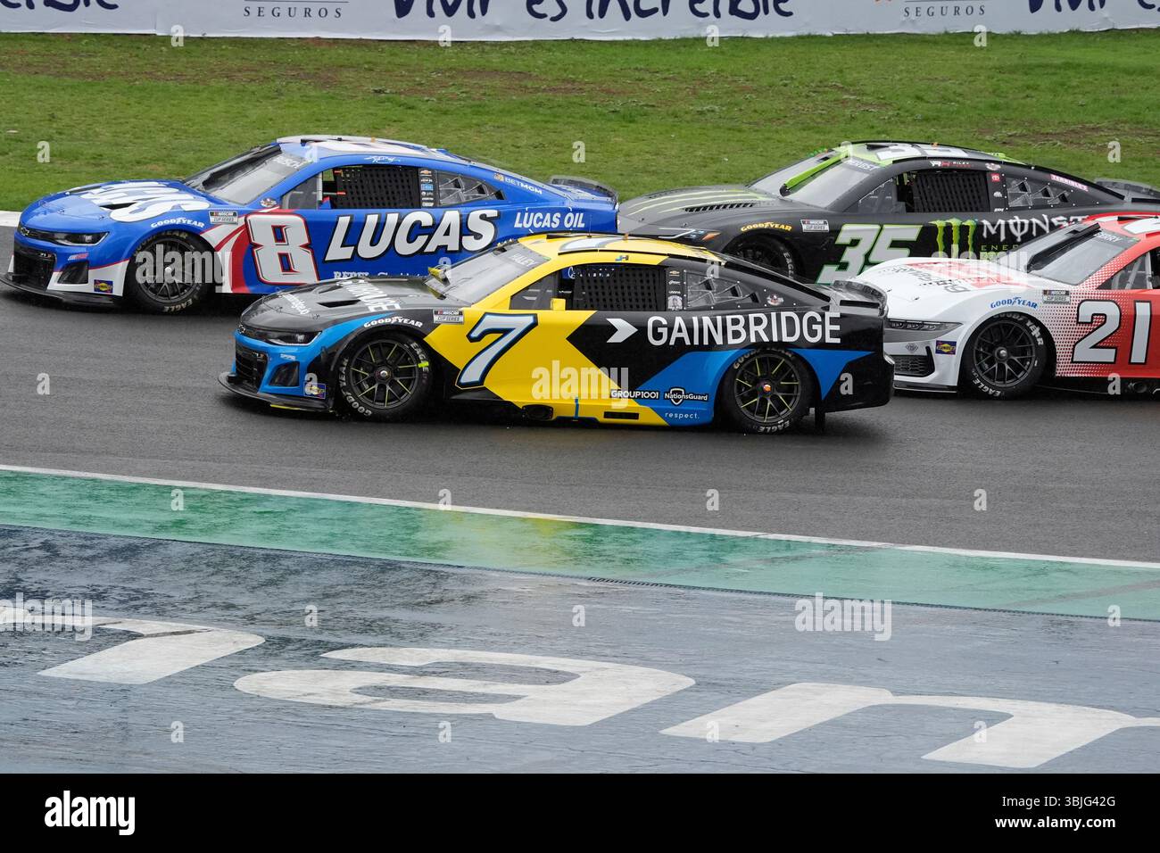 Drivers battle for position during a NASCAR Cup Series auto race at ...