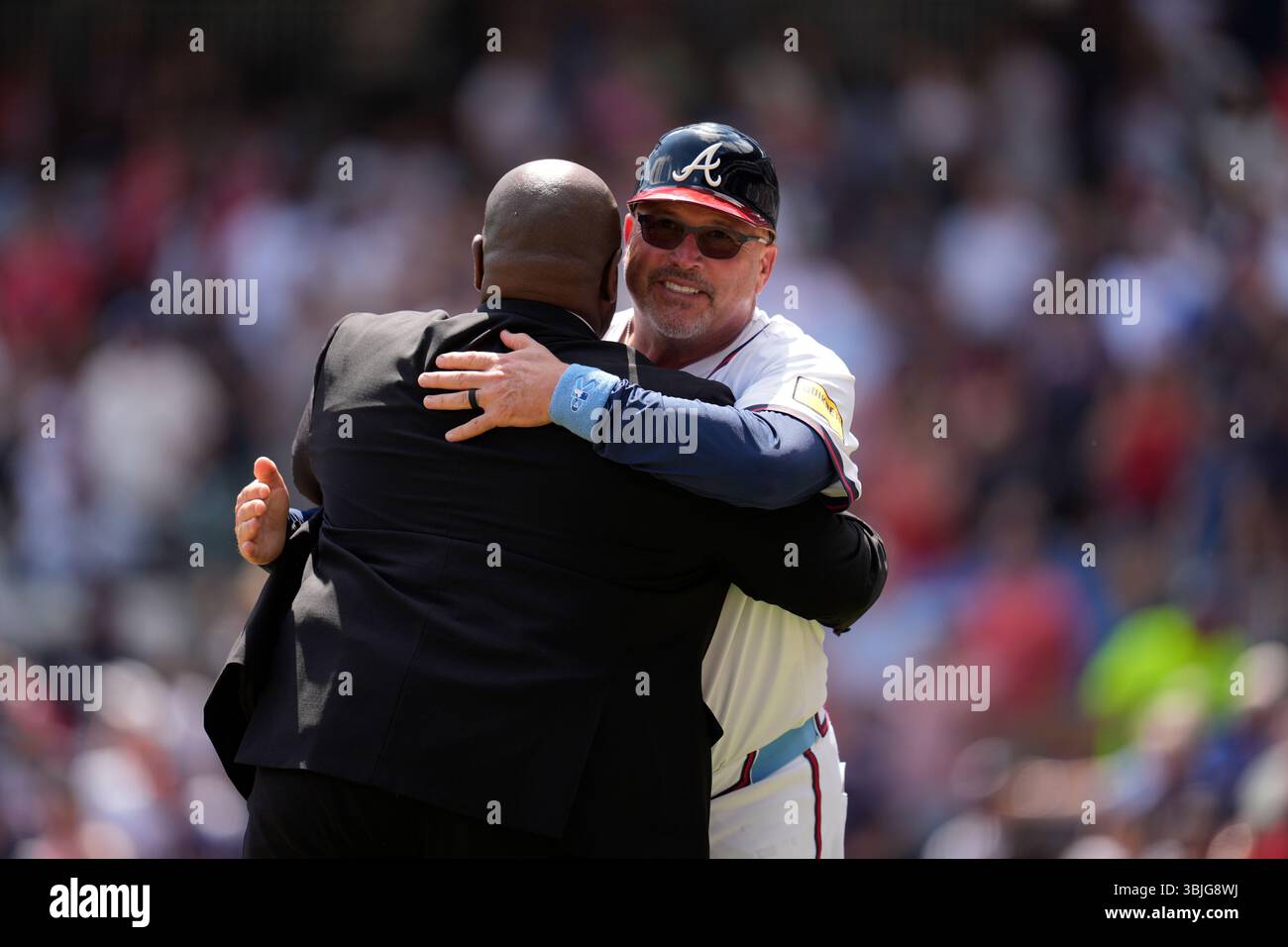 Opera singer Timothy Miller, embraces Atlanta Braves third baseman ...
