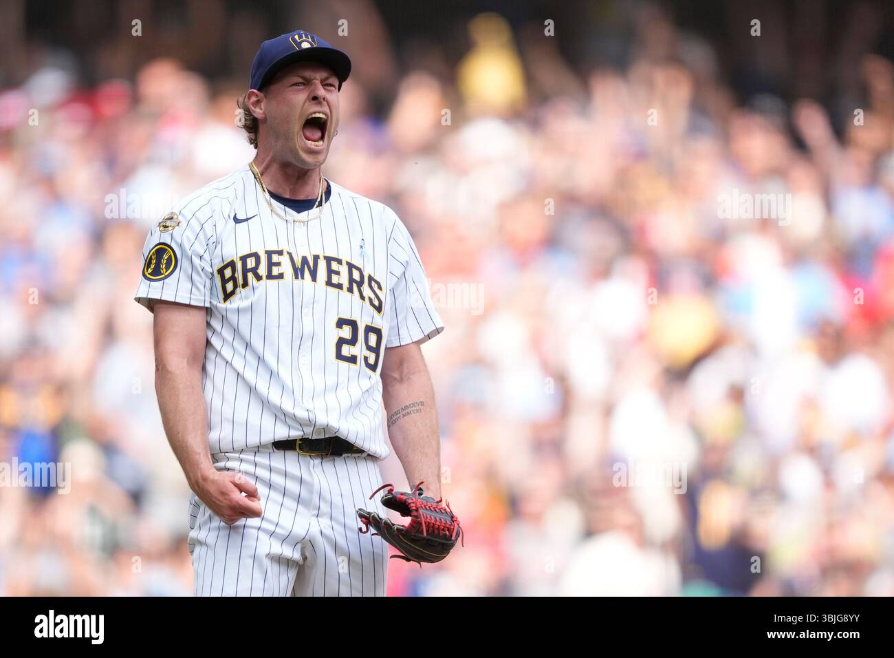 Milwaukee Brewers' Trevor Megill reacts after recording a save during ...