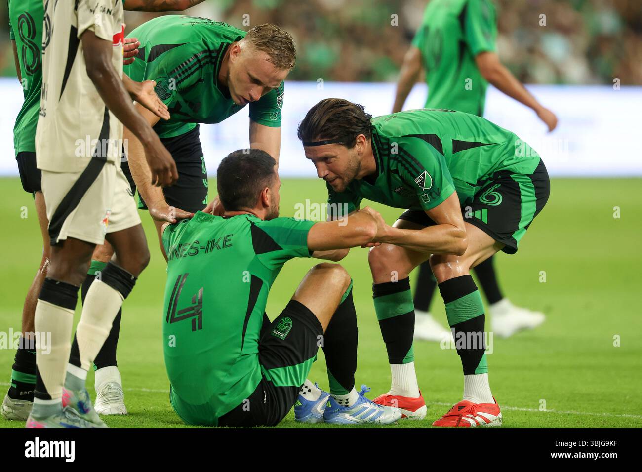 AUSTIN, TX - JUNE 14: Austin FC defender Brendan Hines-Ike (4) is met ...