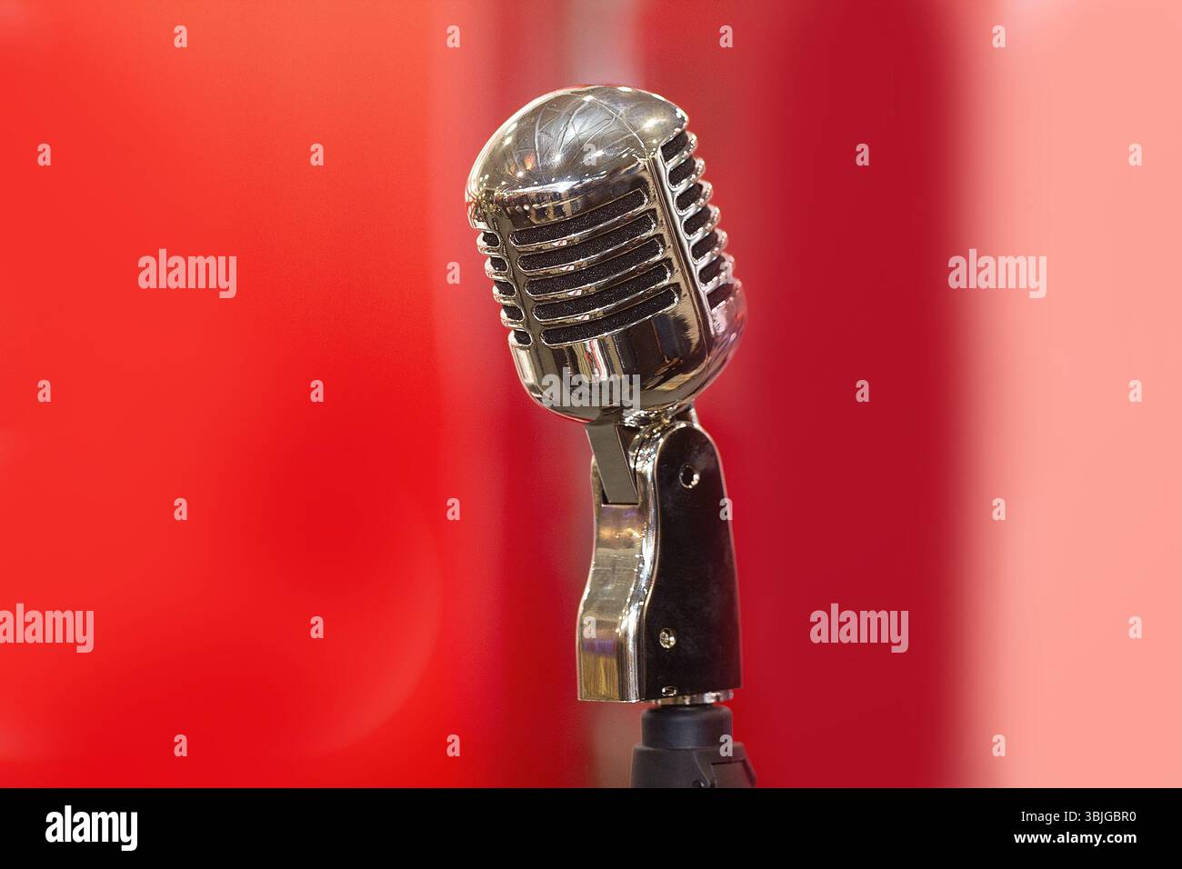 Vintage microphone on stage on a red background. Music Stock Photo - Alamy