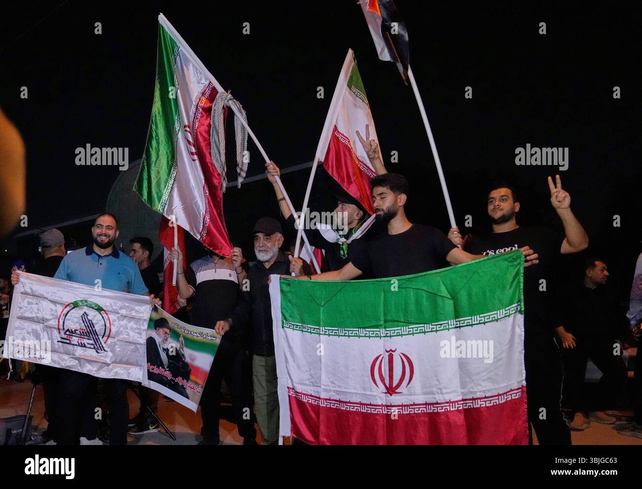 Protesters carry Iranian flags during a protest against Israeli attacks ...