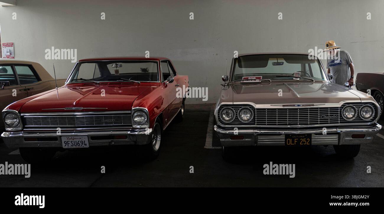 Sam Becerra, of Orange, Calif., examines an old-school Chevy during the ...