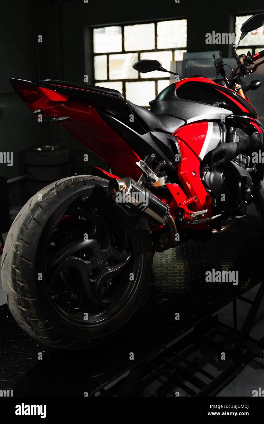 Precision oil fill operation on a red sportbike to ensure proper engine ...